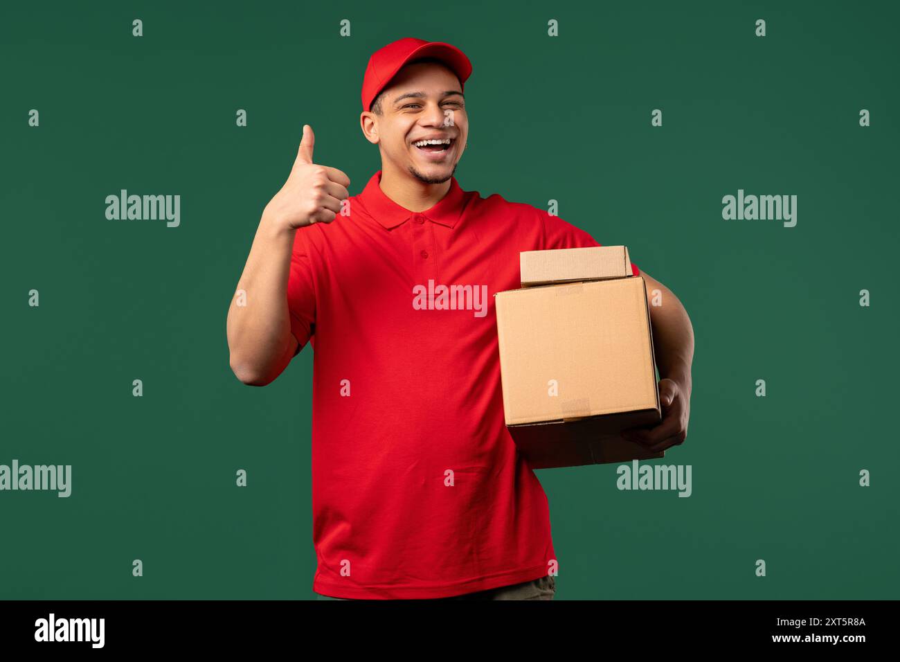 Positive postal courier man with hands sign like, thumbs up. Happy ...