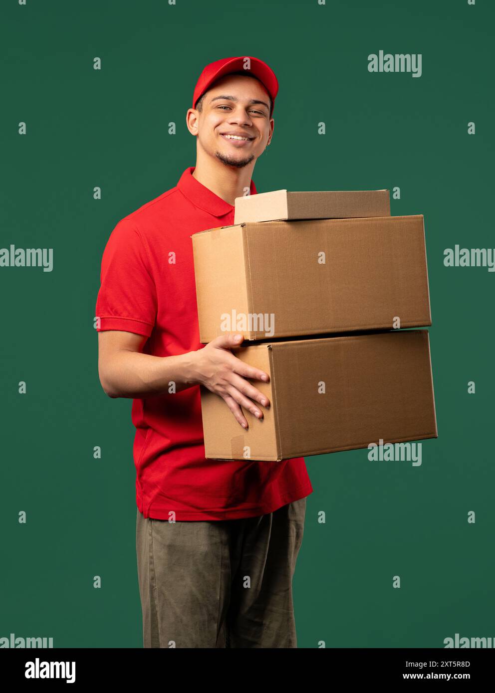 Positive postal courier man with parcel box. Happy postman delivers ...