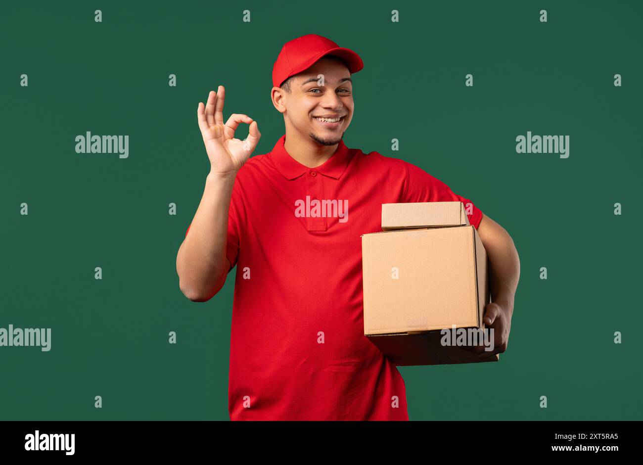 Positive postal courier man with hands sign OK, okay. Happy postman on ...