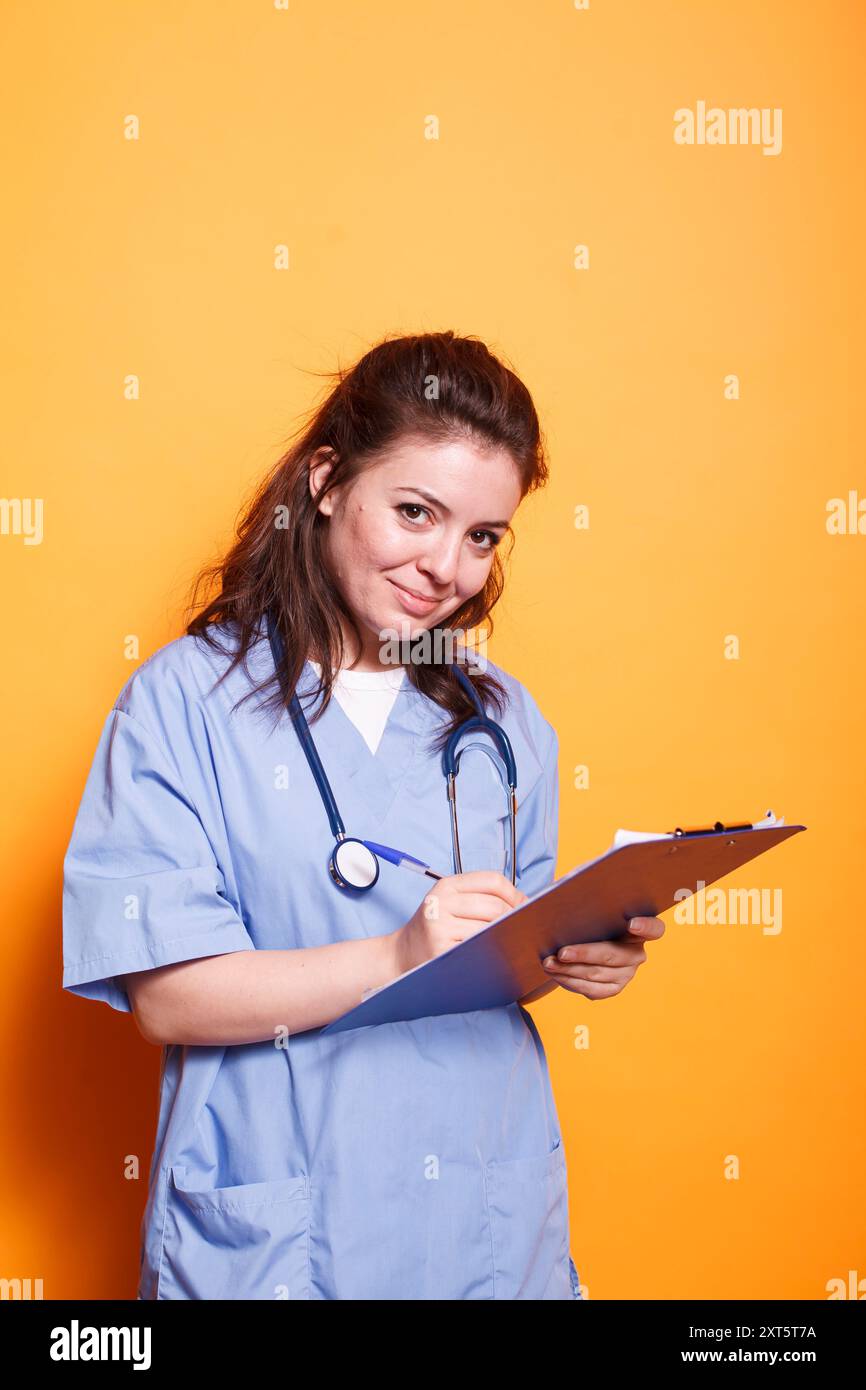 Female nurse doctor reviewing papers hi-res stock photography and ...
