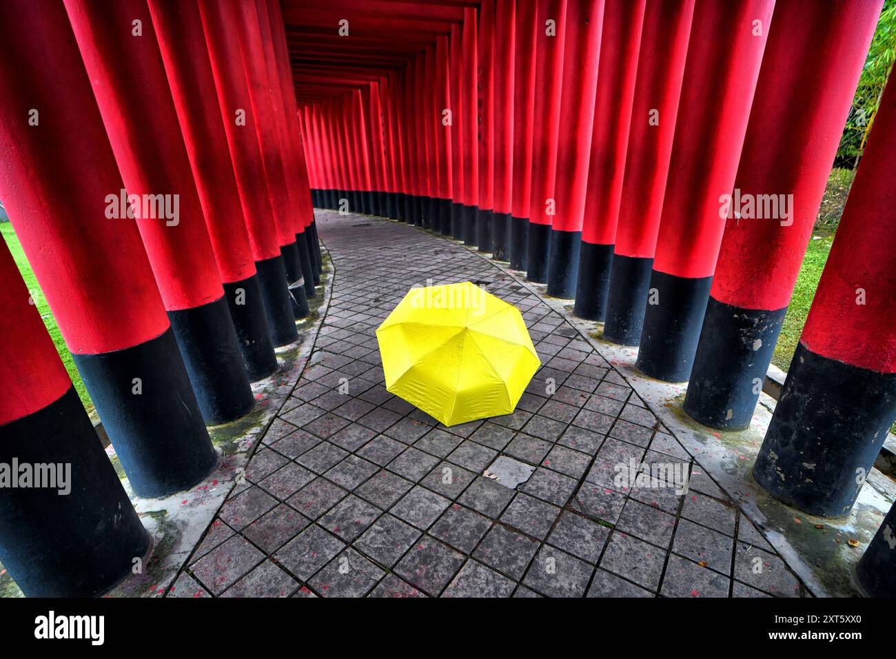 A yellow umbrella seen at the main entrance zone of the Japanese Forest ...
