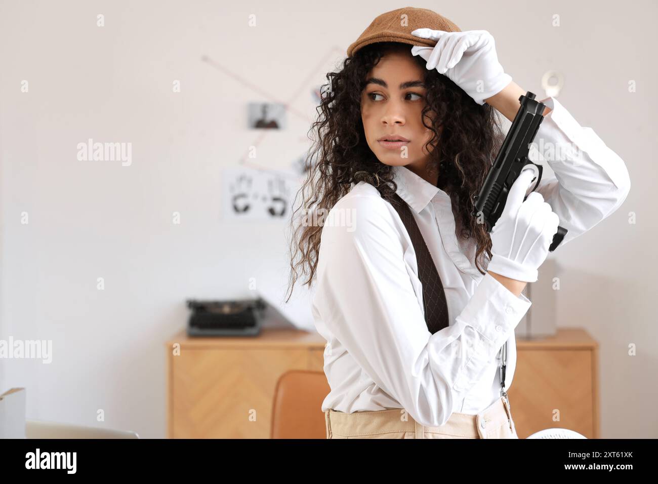 Female African-American spy with gun in office Stock Photo - Alamy