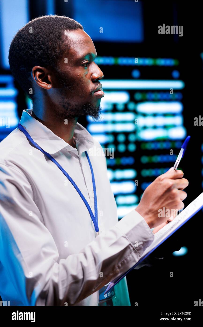 Expert Conducting Diagnostic Tests On Server Racks To Identify And Rectify Issues With Data