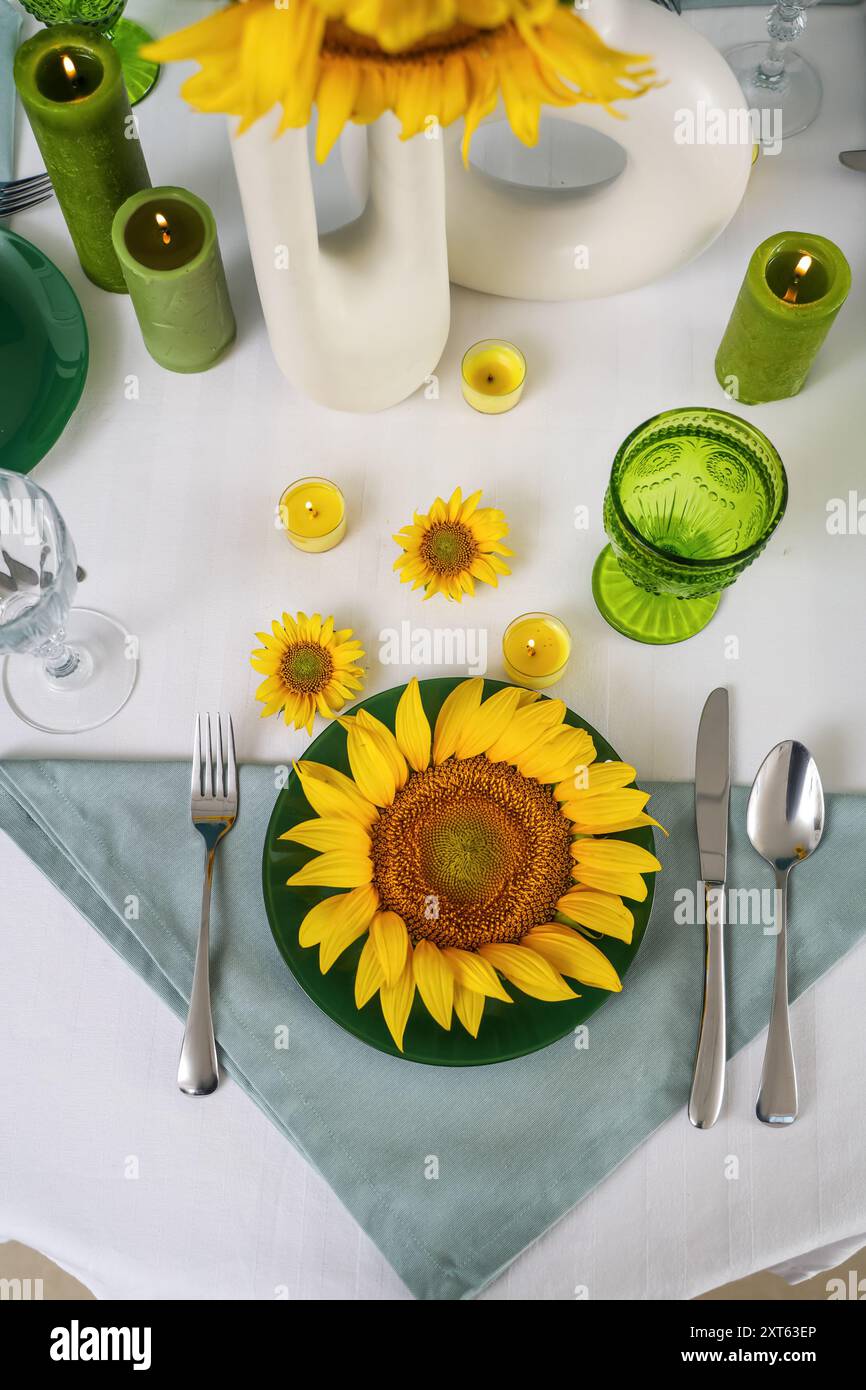 Beautiful table setting with sunflower in plate. Top view Stock Photo ...