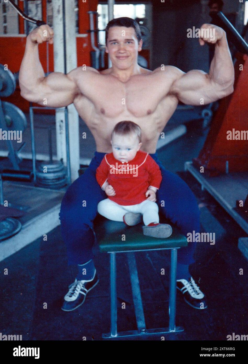 HOLLYWOOD LEGEND ARNOLD SCHWARZENEGGER WITH A YOUNG ADMIRER AT BOB ...