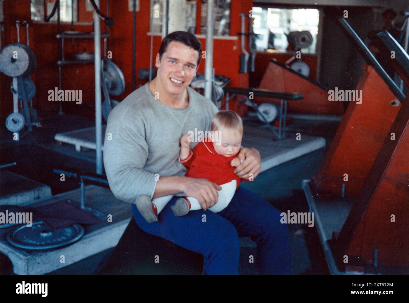 HOLLYWOOD LEGEND ARNOLD SCHWARZENEGGER WITH A YOUNG ADMIRER AT BOB ...