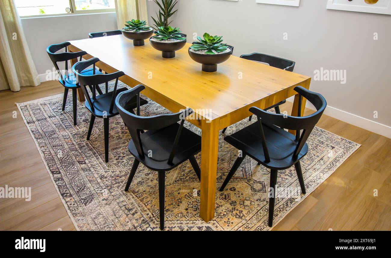 Wooden Dining Room Table With Eight Chairs Stock Photo - Alamy
