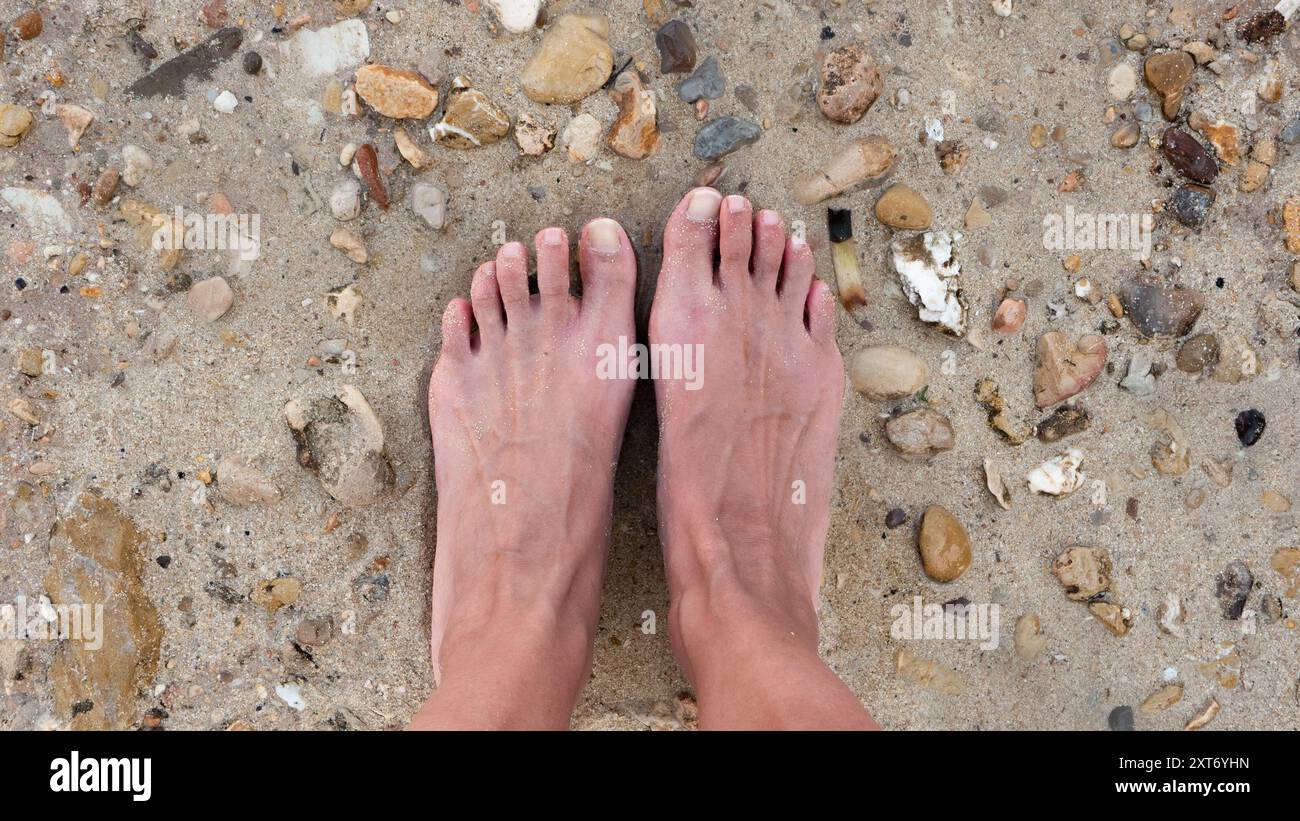 Top view of a woman feet on beach sand background Stock Photo - Alamy