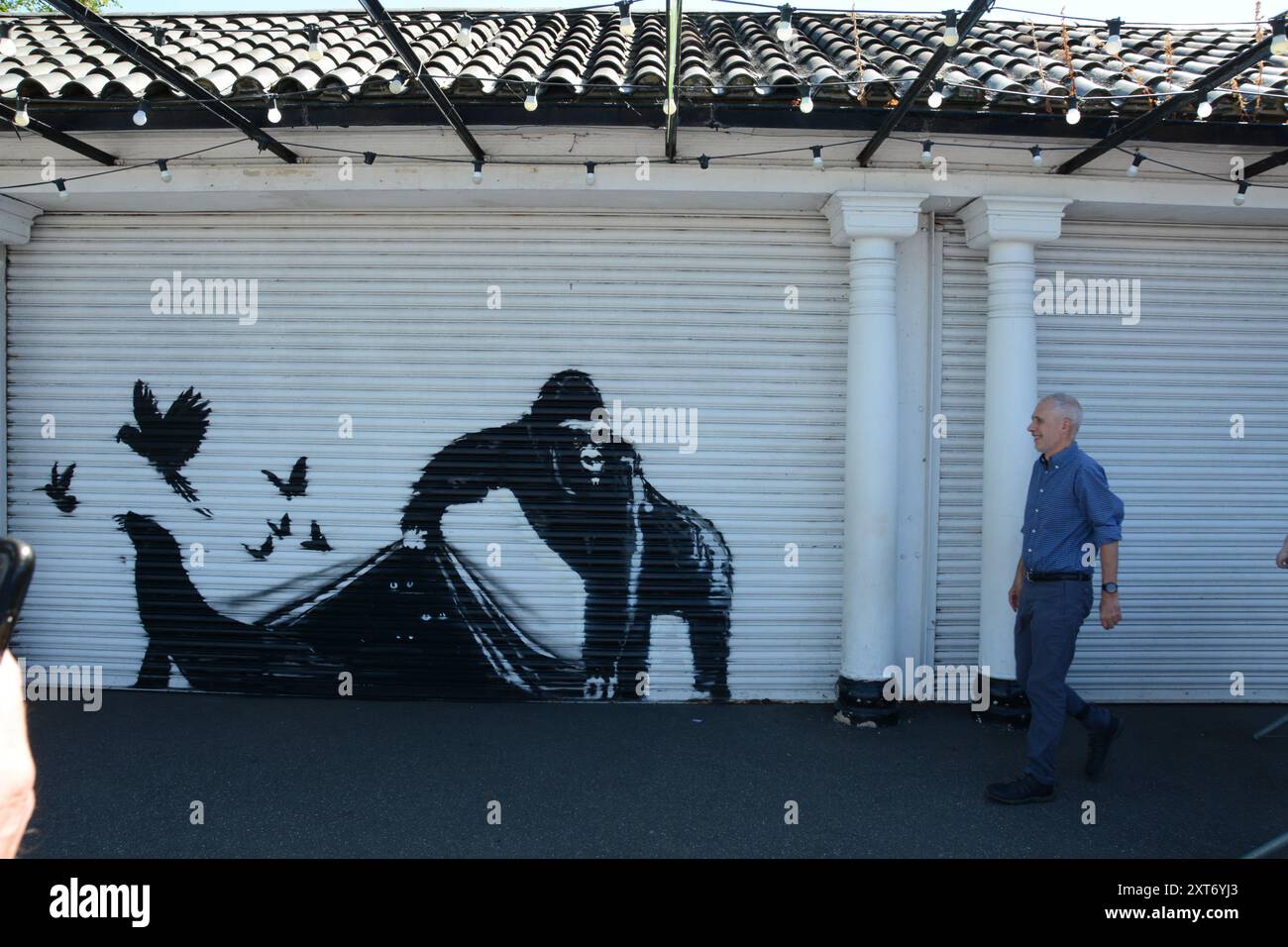 Sir Jim Smith poses in front of Banksy's final work in a series of 9 ...