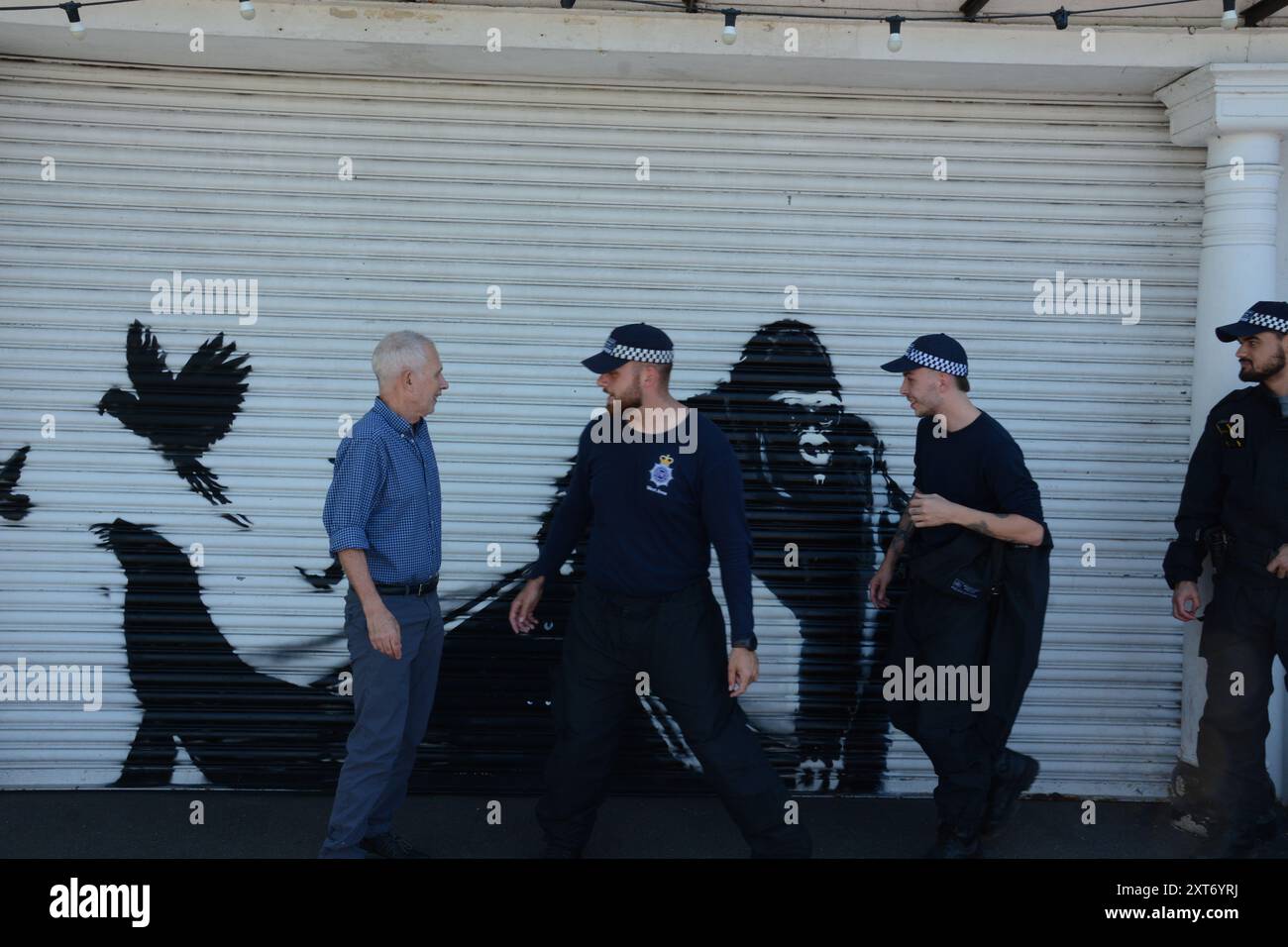 Sir Jim Smith poses in front of Banksy's final work in a series of 9 ...