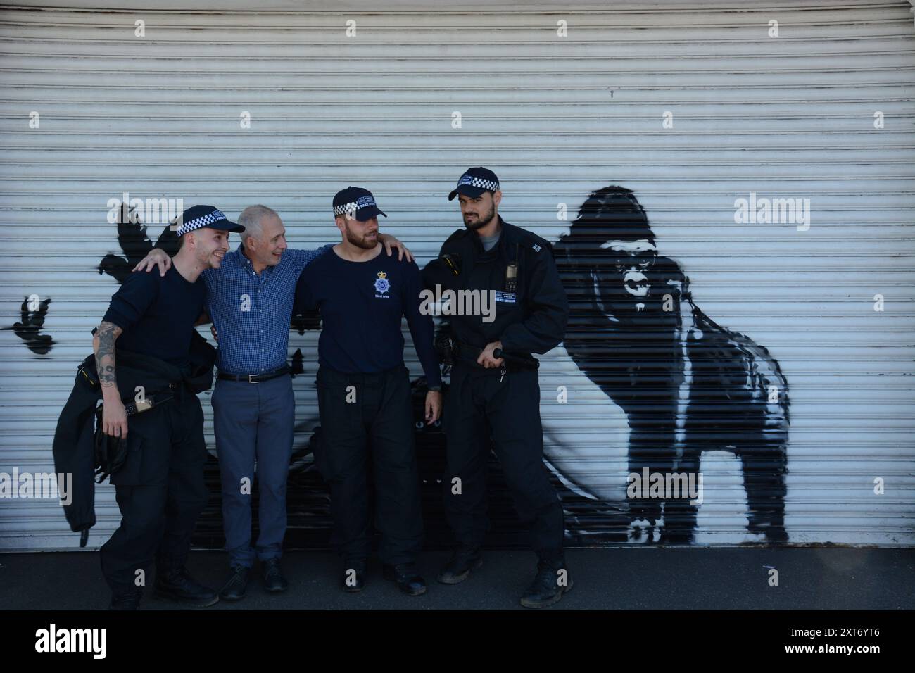 Sir Jim Smith poses in front of Banksy's final work in a series of 9 ...