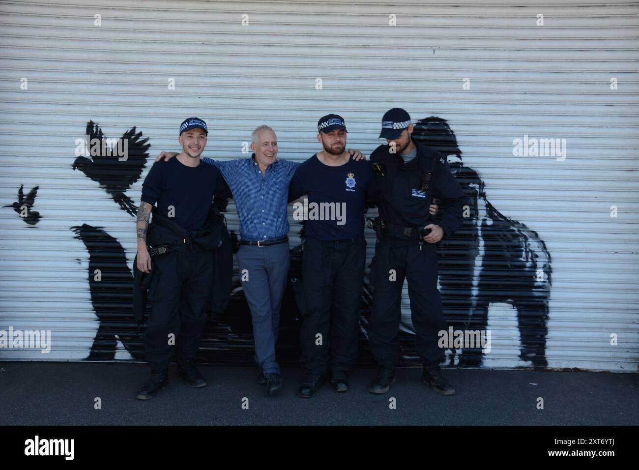 Sir Jim Smith poses in front of Banksy's final work in a series of 9 ...