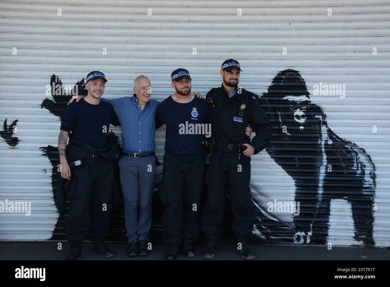 Sir Jim Smith poses in front of Banksy's final work in a series of 9 ...