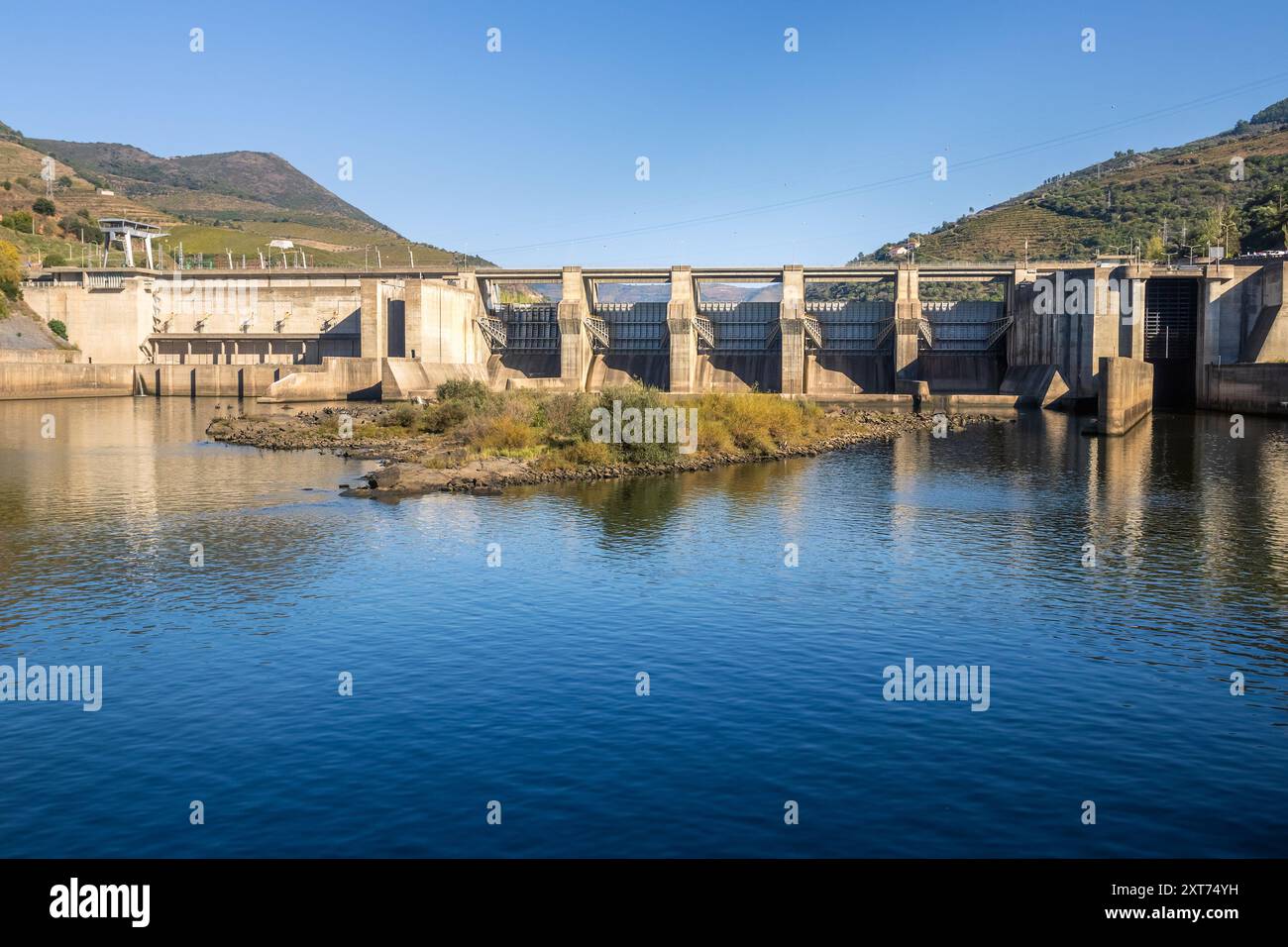Front view of the Régua dam on the Douro River in Portugal, on a sunny ...