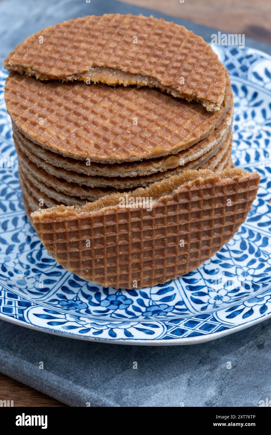 Traditional Dutch sweet dessert, pile of Butter caramel syrup waffles ...