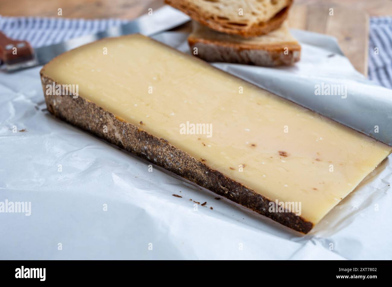 French aged in caves cheese Comte with brown rind, made from ...