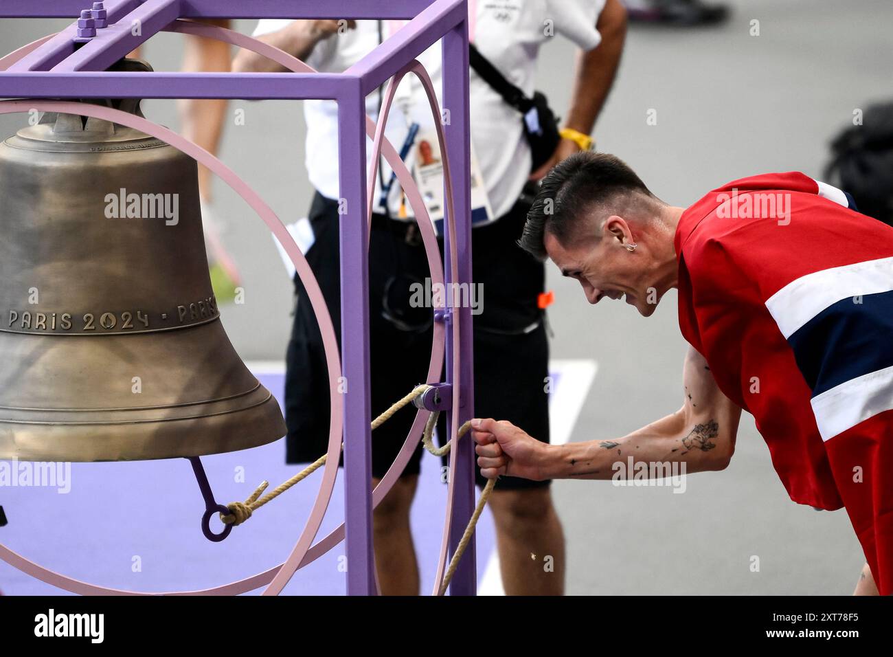 Jakob Ingebrigtsen of Norway rings the bell after competing in the men's 5000m final during the ...
