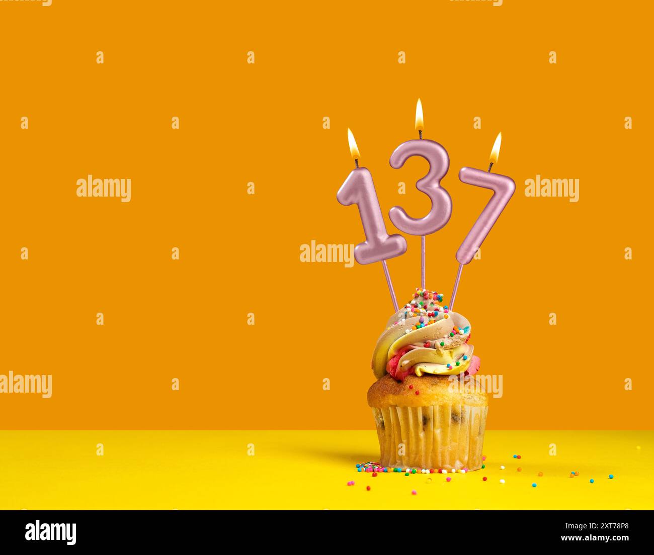 Birthday celebration with cupcake - Candle number 137 Stock Photo - Alamy