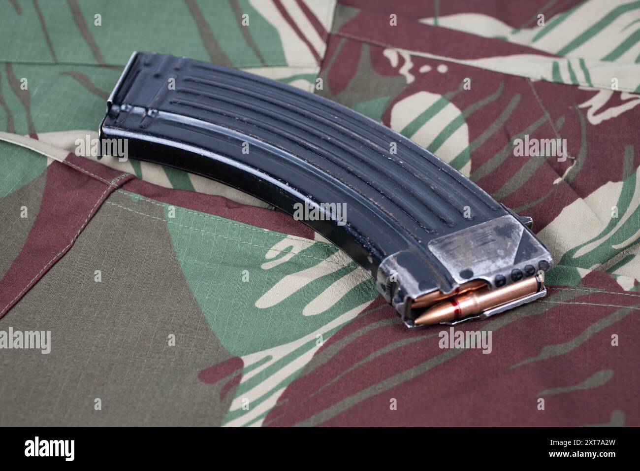kalashnikov ammunition magazine with cartridges on camo uniform ...
