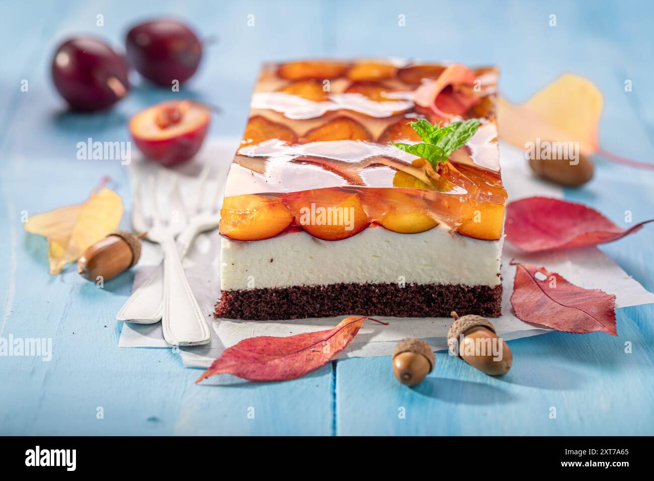 Tasty and sweet plum sponge cake with whipped cream and jelly. Sponge ...