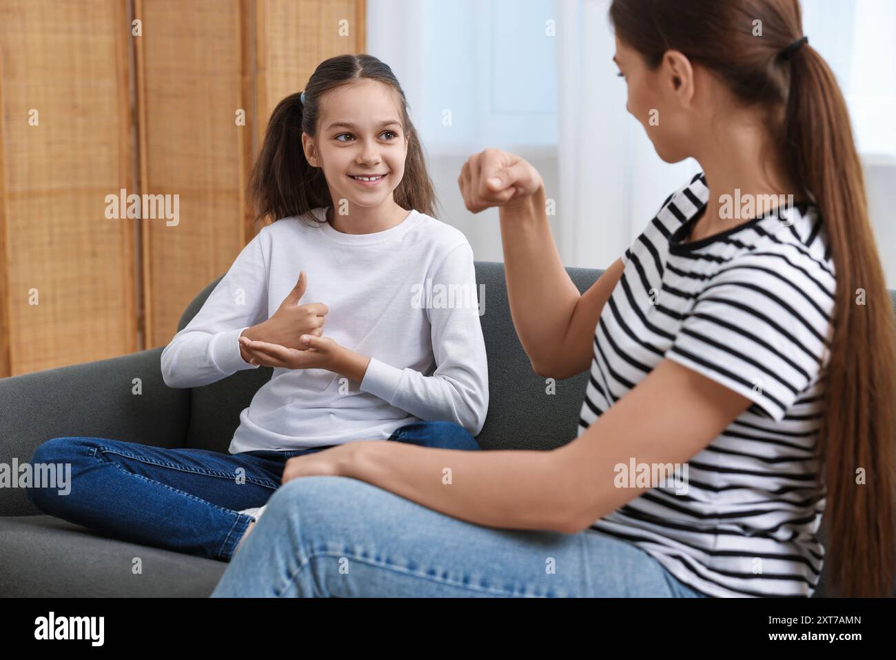 Deaf child adult using sign language hi-res stock photography and ...
