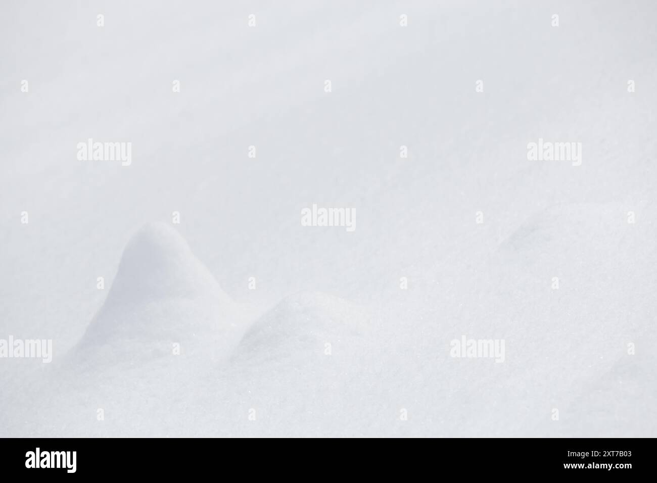 Small mounds of white snow surface in winter landscape background Stock ...