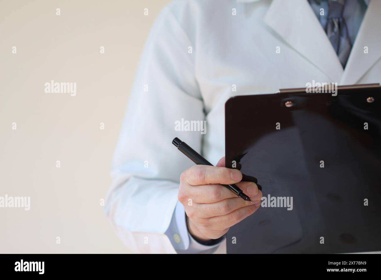 Medical professional taking notes Stock Photo - Alamy
