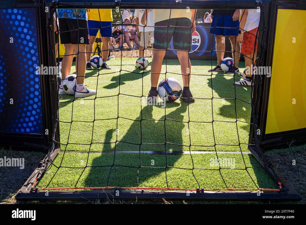 Visitors to the Fan Festival are shown some freestyle football tricks ...