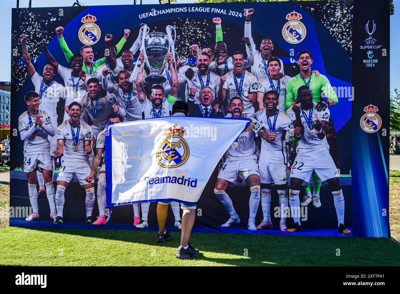 A Real Madrid fan poses for a photograph in front of the 2024 Champions ...