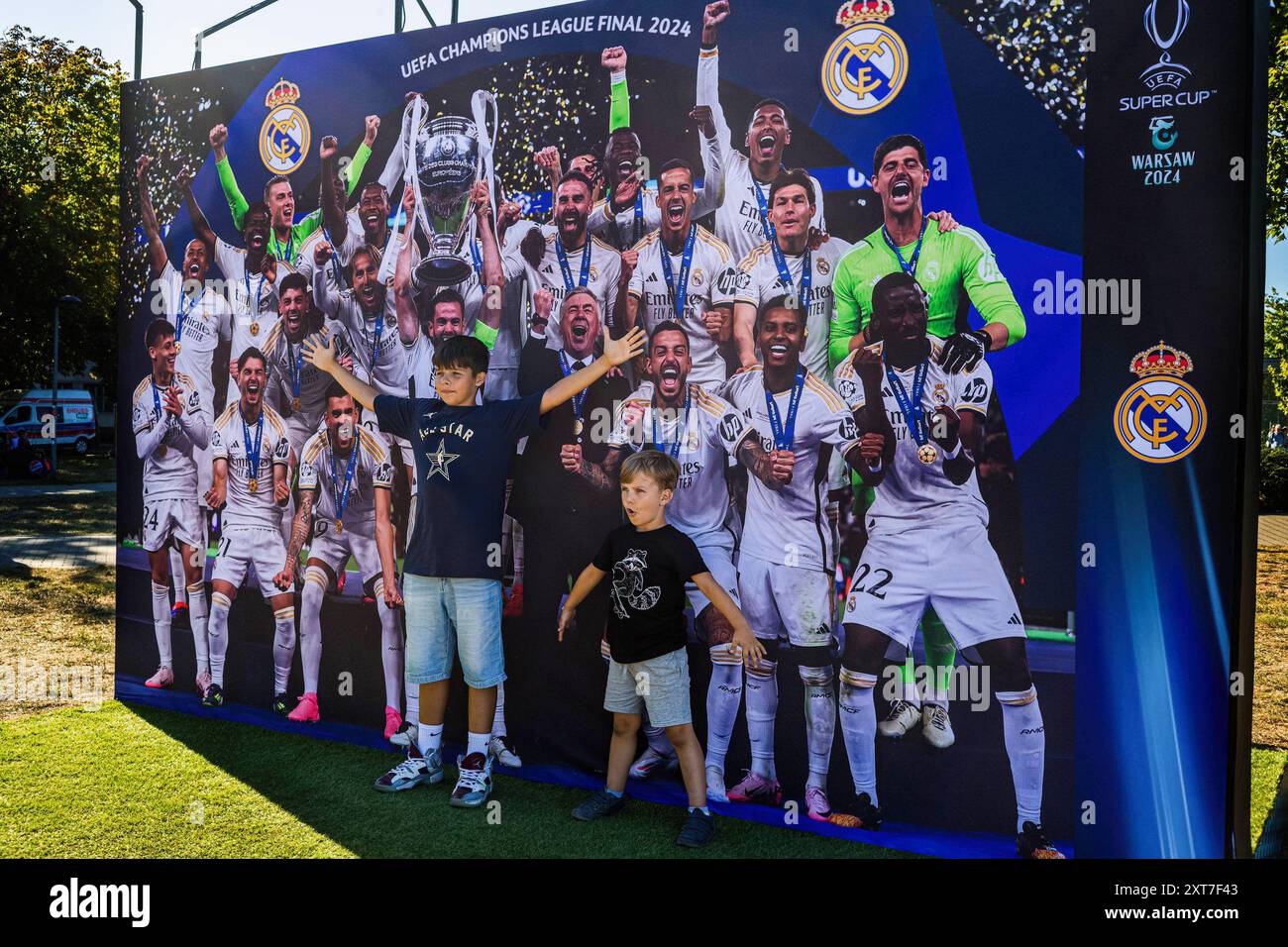 Real Madrid fans pose for a photograph in front of the 2024 Champions ...