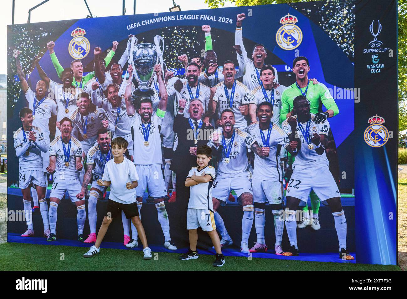Real Madrid fans pose for a photograph in front of the 2024 Champions ...