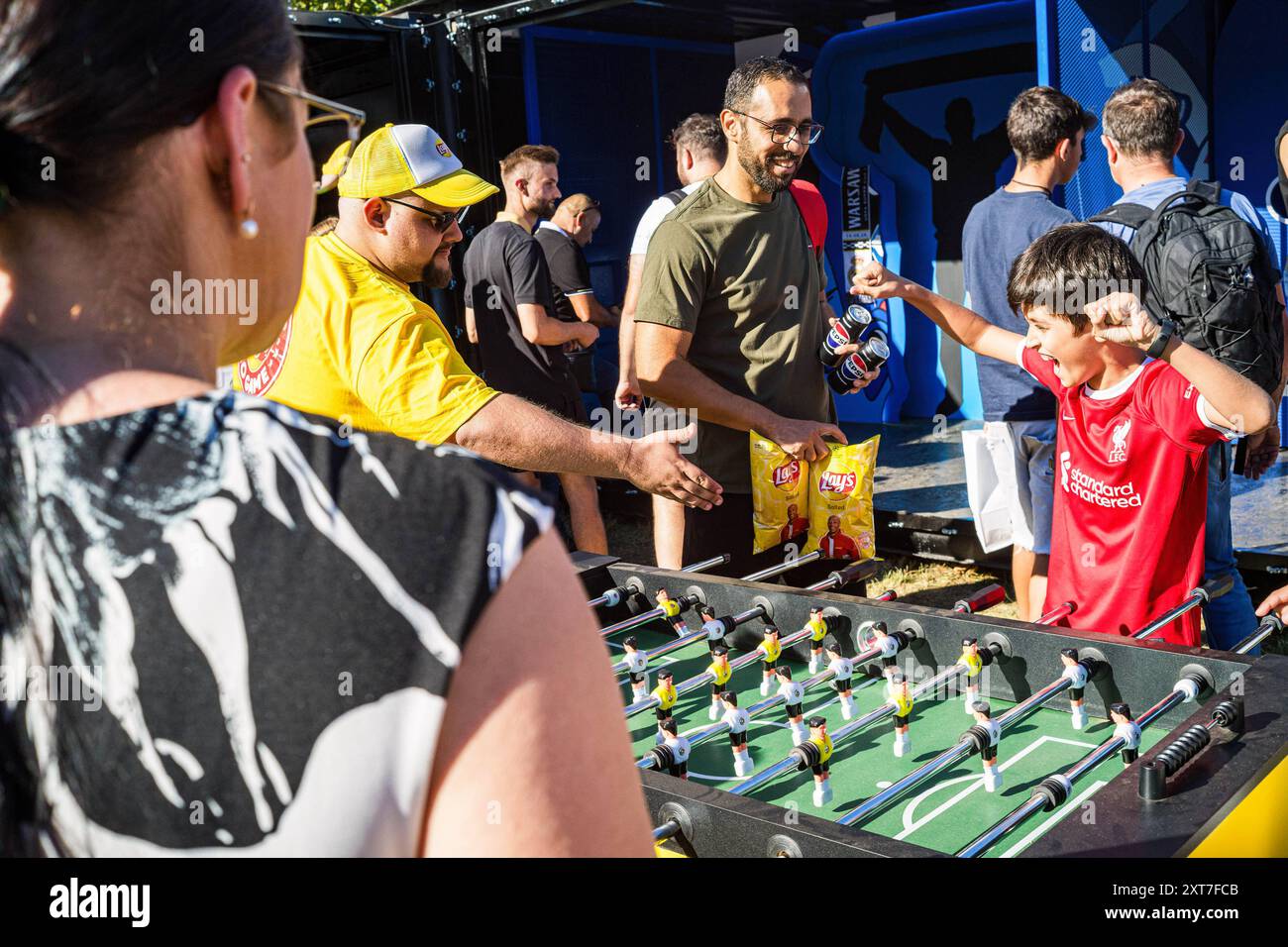 A young football fan wins at the football table. Fans of Spanish ...