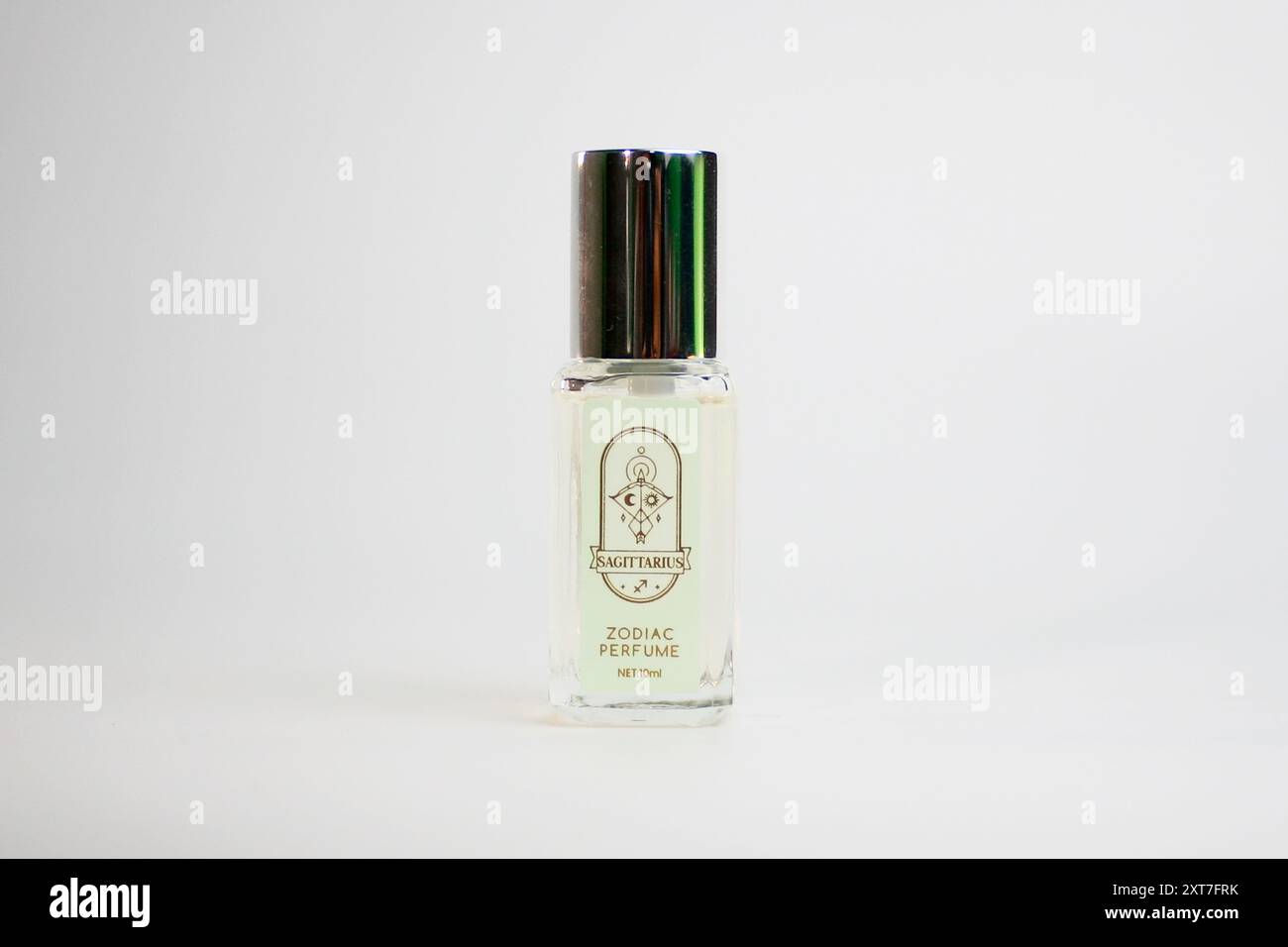 Close up a mini bottle of Miniso Zodiac Perfume Sagittarius isolated on ...