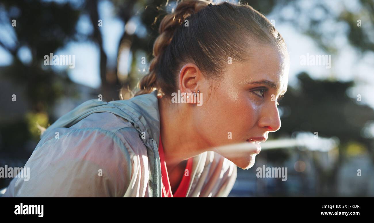 Outdoor, tired and rest of woman for fitness, exercise and break after ...