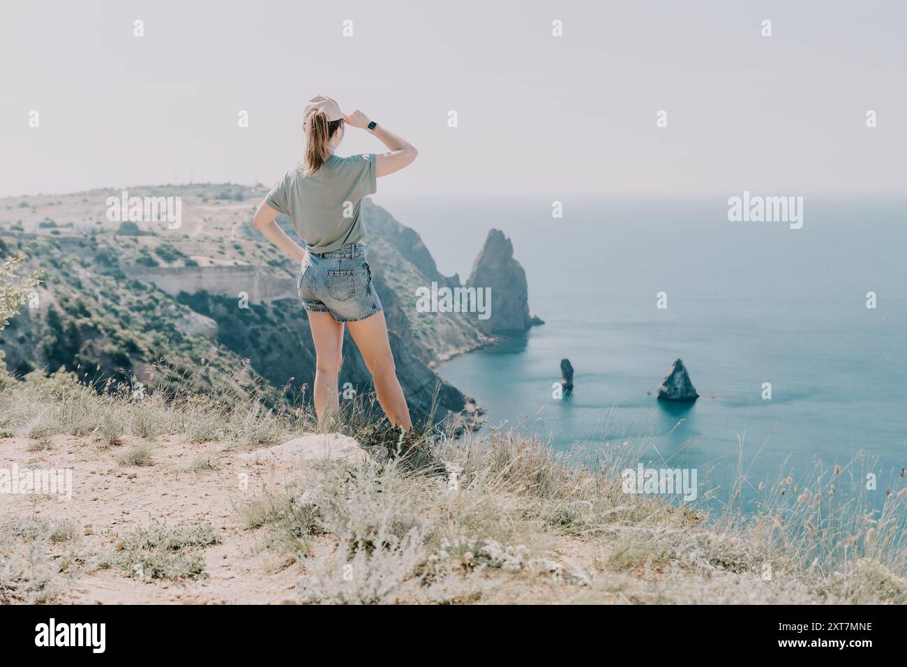 Woman Gazing at the Coastal Landscape Stock Photo - Alamy