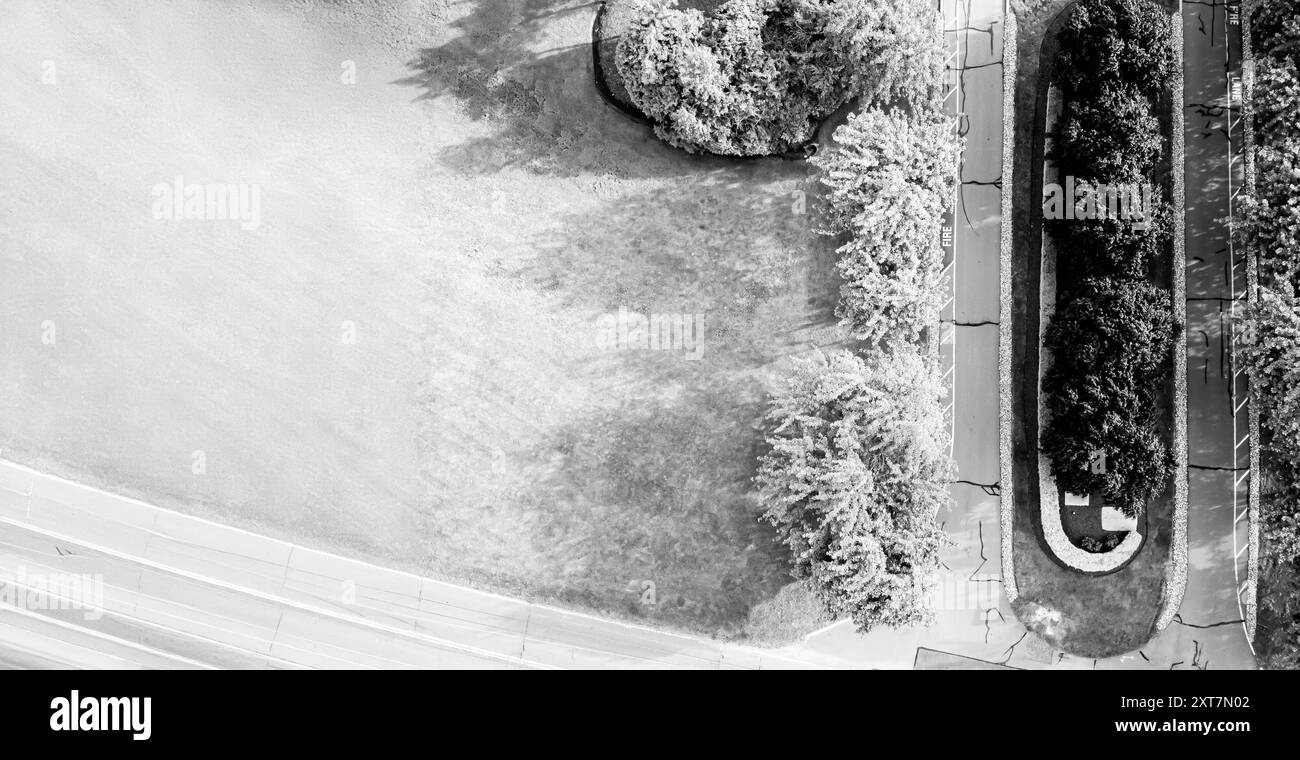 Drone overhead aerial view of a two-drive entry with a landscaped ...