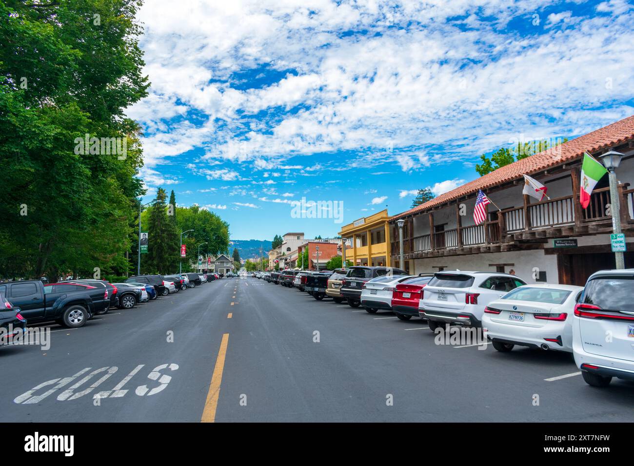 Cars parked by Sonoma Plaza in downtown Sonoma flanked by historical ...