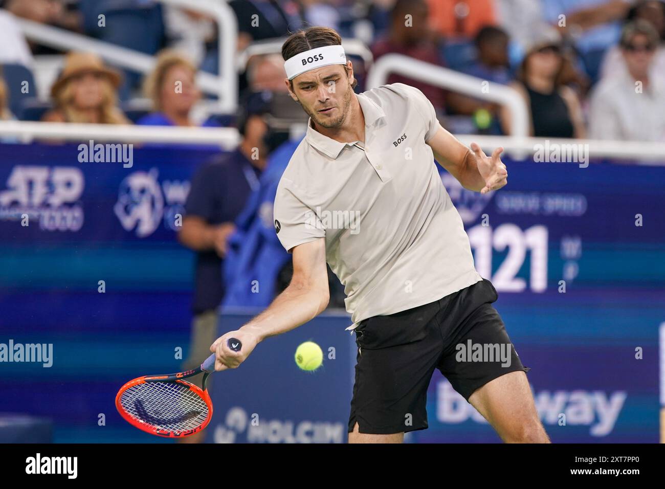 Mason, Ohio-AUG 14, 2024.Taylor Fritz returns a shot during mens ...