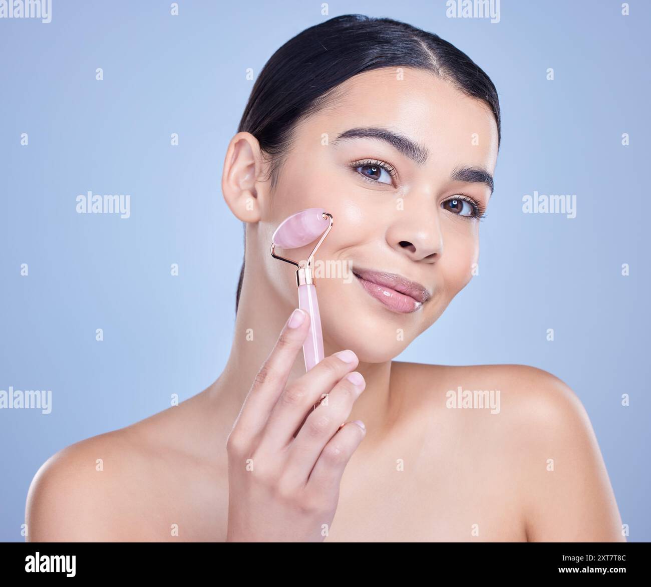 Skincare, face roller and portrait of woman in studio with lymph ...