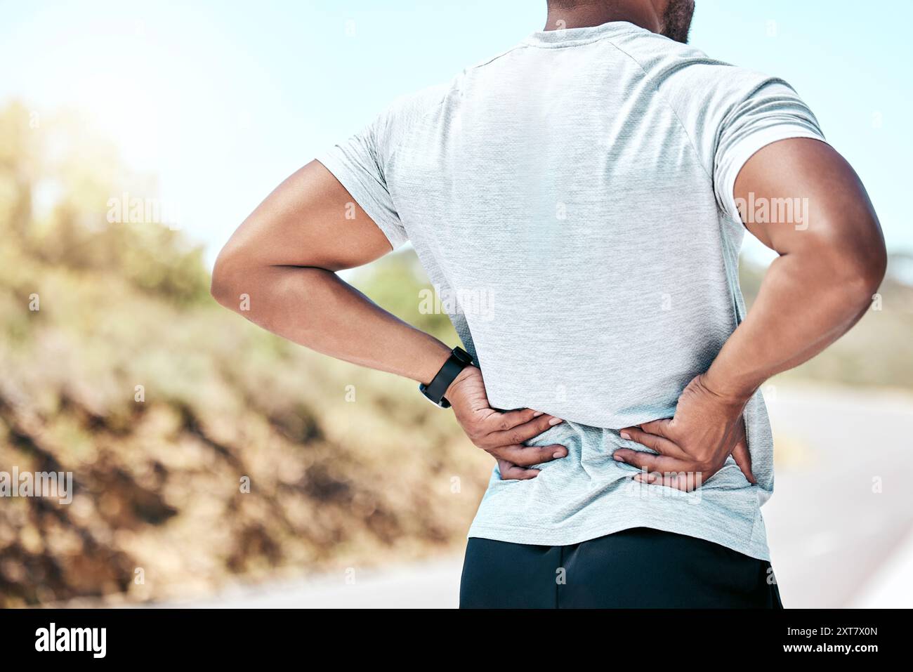 Back pain, fitness and man with injury outdoor after training, accident ...