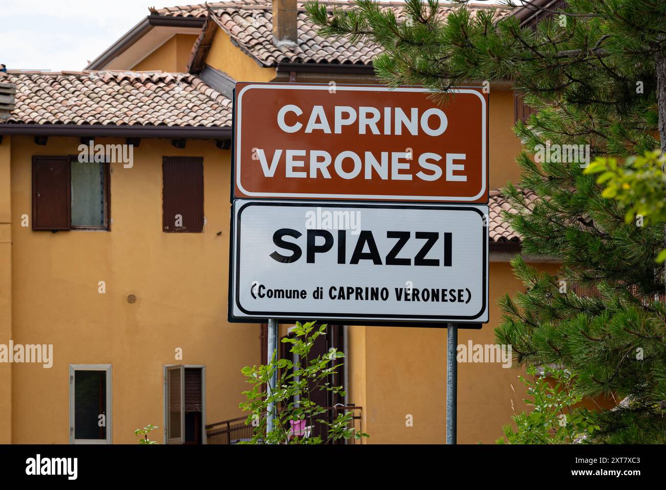 Location plate and speed limit sign of the mountain village of Spiazzi ...