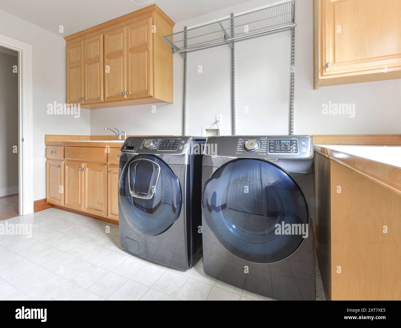 Modern residential laundry room interior Stock Photo - Alamy