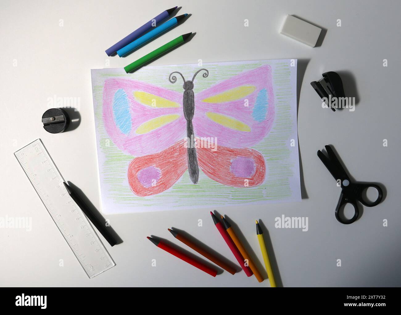 Photo of child's drawing with colored pencils. In the picture is ...