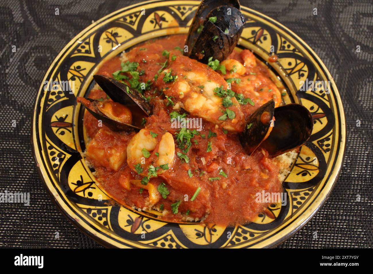 Moroccan cuisine: seafood and tomato couscous Stock Photo - Alamy