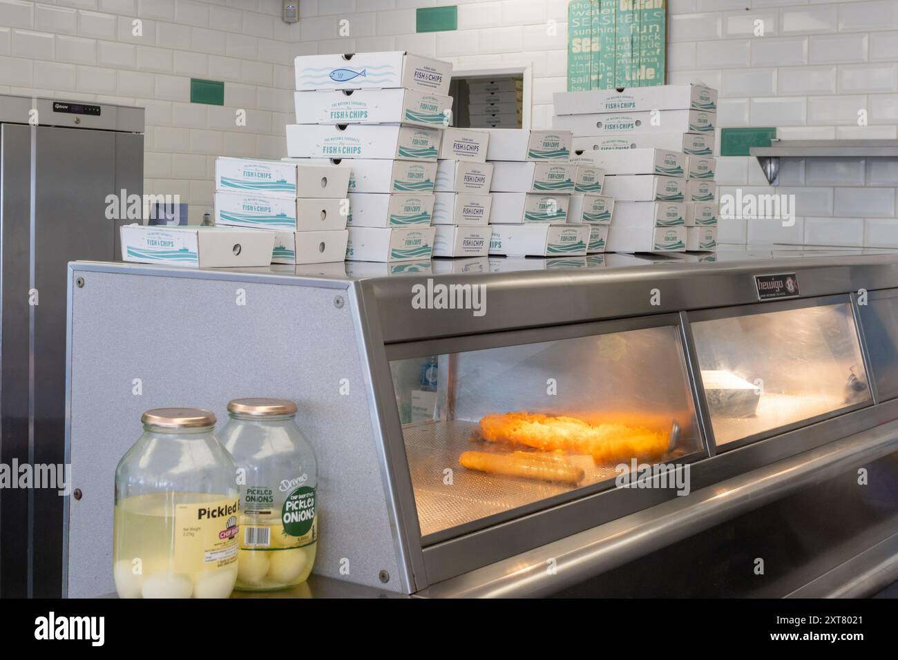 Interior of a fish and chip shop in Sussex, UK showing empty boxes ...