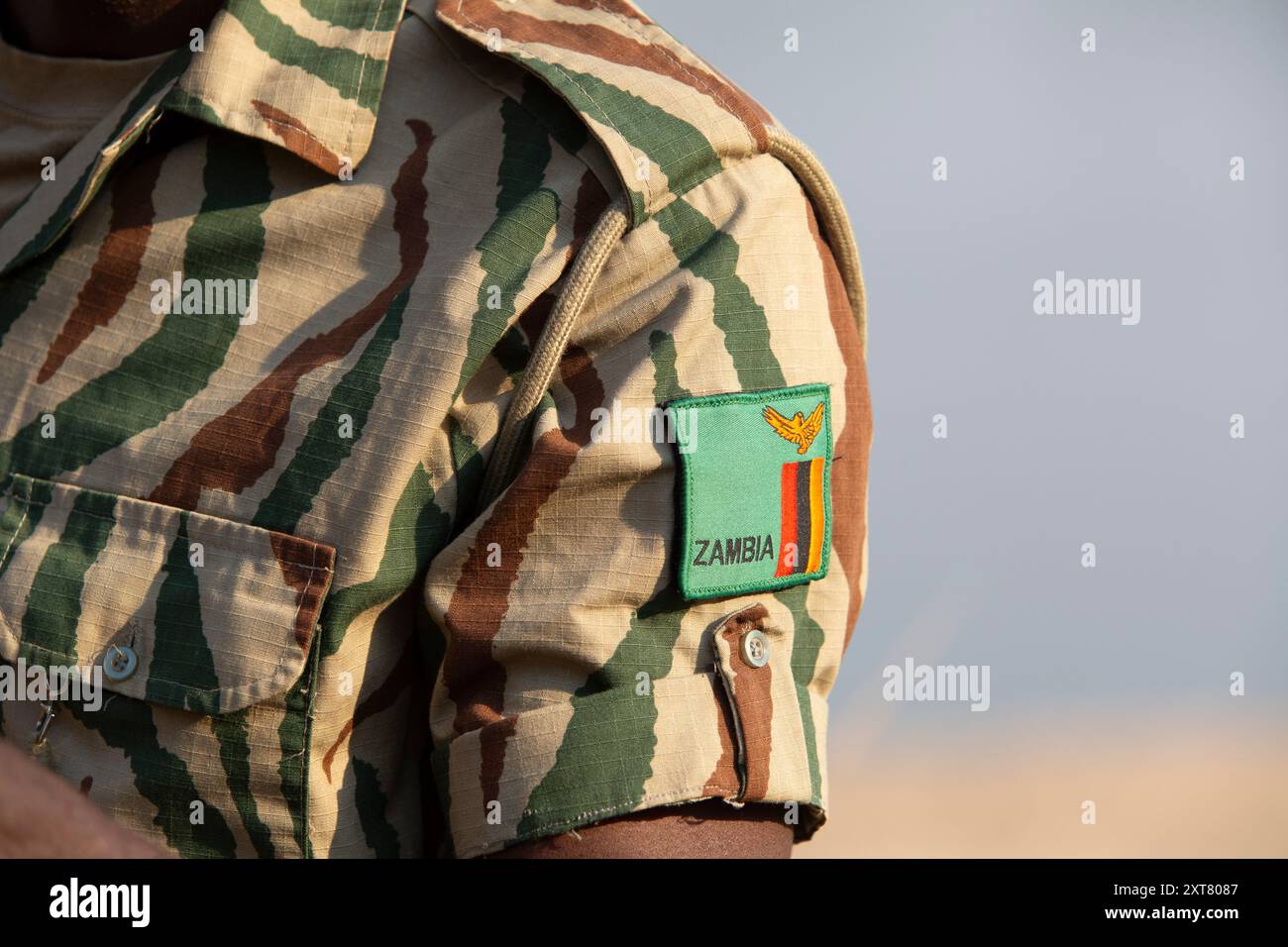 Closeup of the uniform of a Game Scout in Luambe National Park showing ...