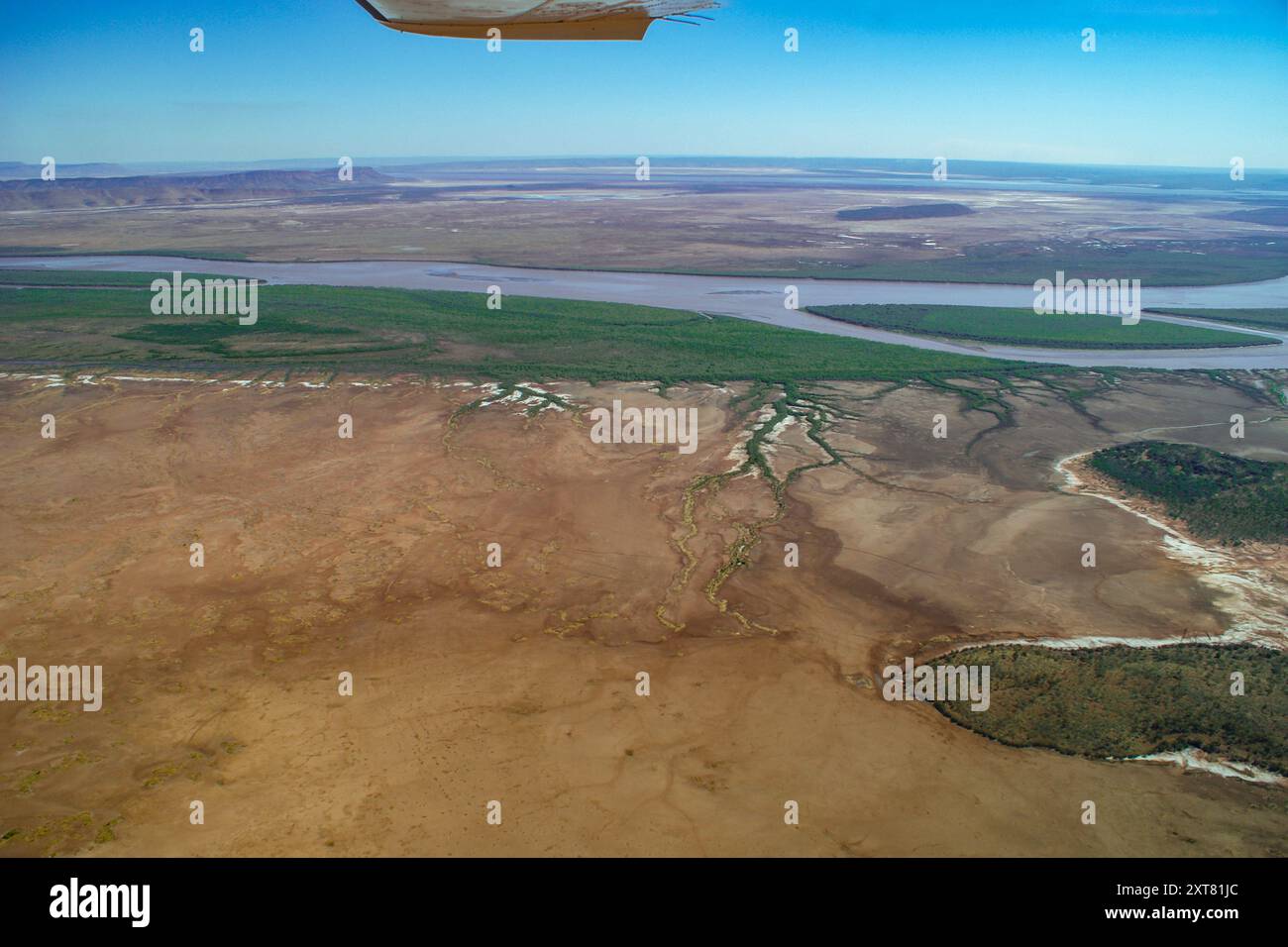 Aerial view of a tidal flat with natural pattern of coastal sediments ...