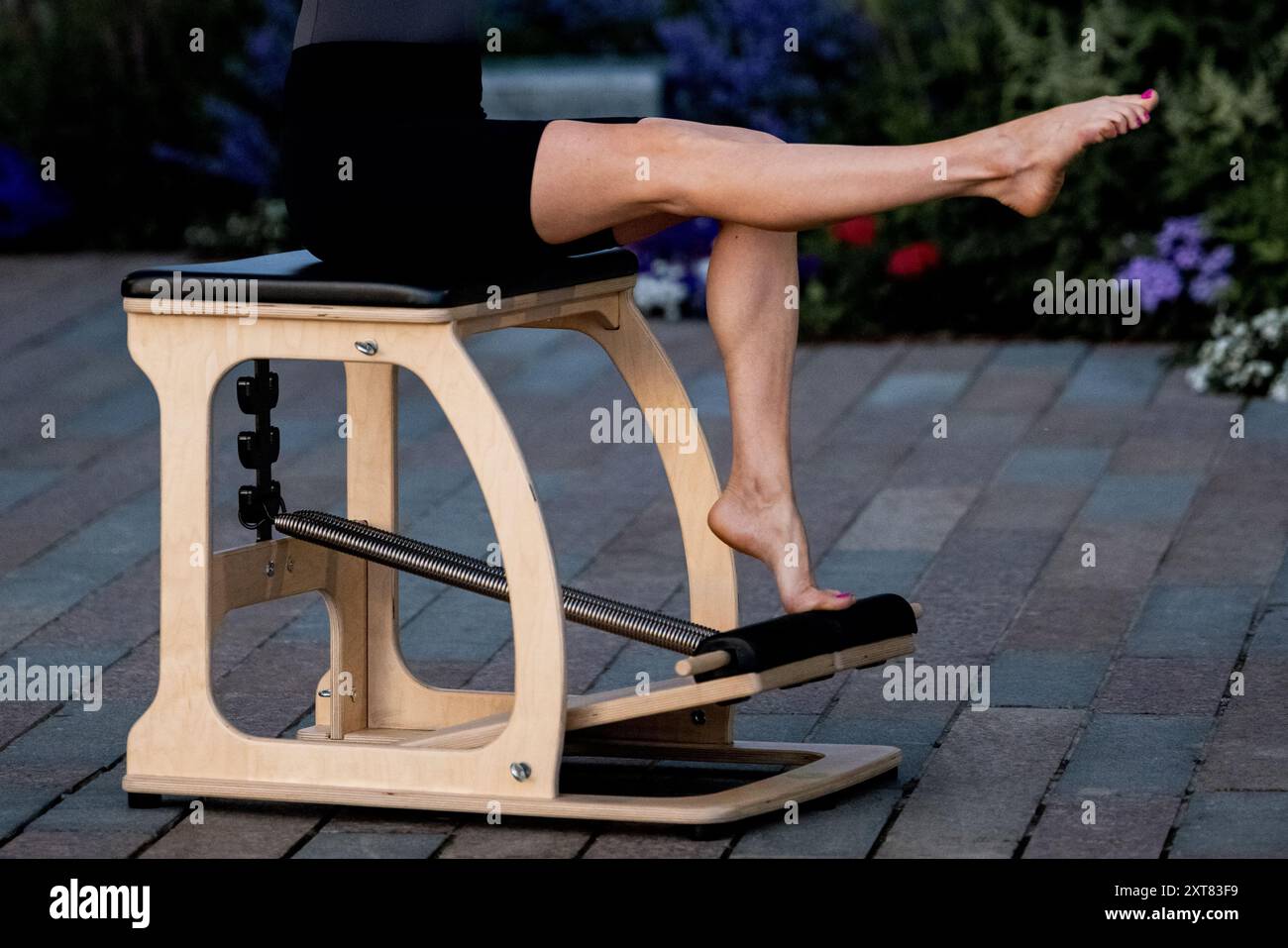 Pilates reformer chair woman fitness yoga gym exercise Stock Photo - Alamy