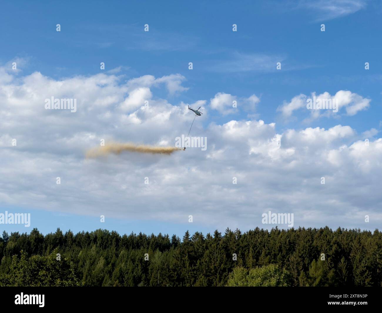 Forest liming with a helicopter Stock Photo - Alamy