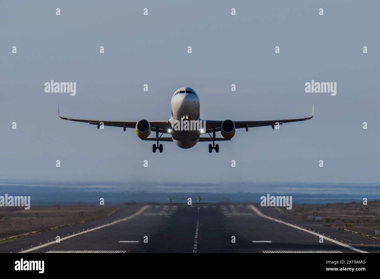 Airplane taking off from runway Stock Photo - Alamy